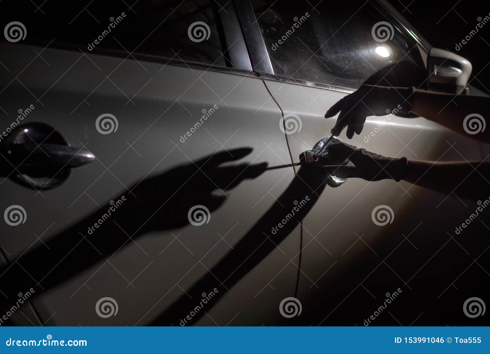 Car Thief Using a Tool To Break into a Car Stock Photo - Image of hand ...