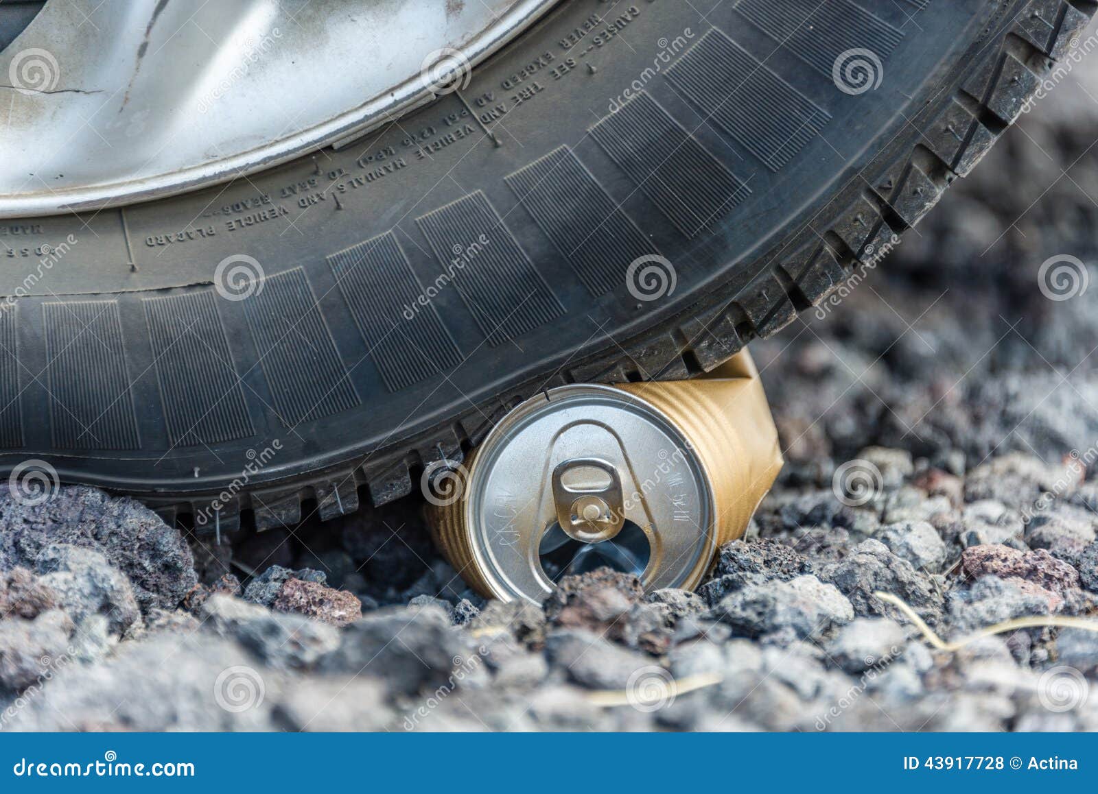 Car tire on can stock photo. Image of force, push, deformed - 43917728