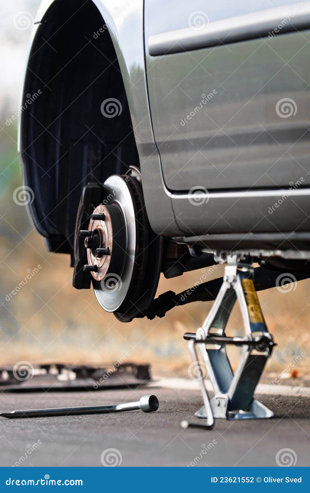 Car without Tire on the Road Stock Photo - Image of work, lifting: 23621552