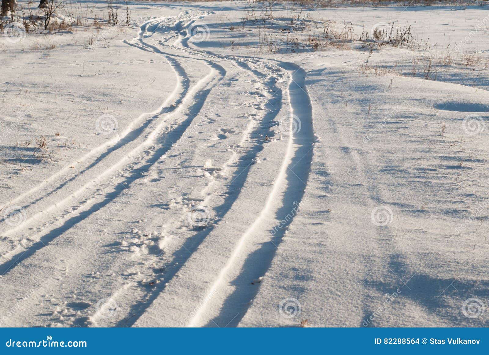 Car tire tracks in snow stock photo. Image of condition - 82288564