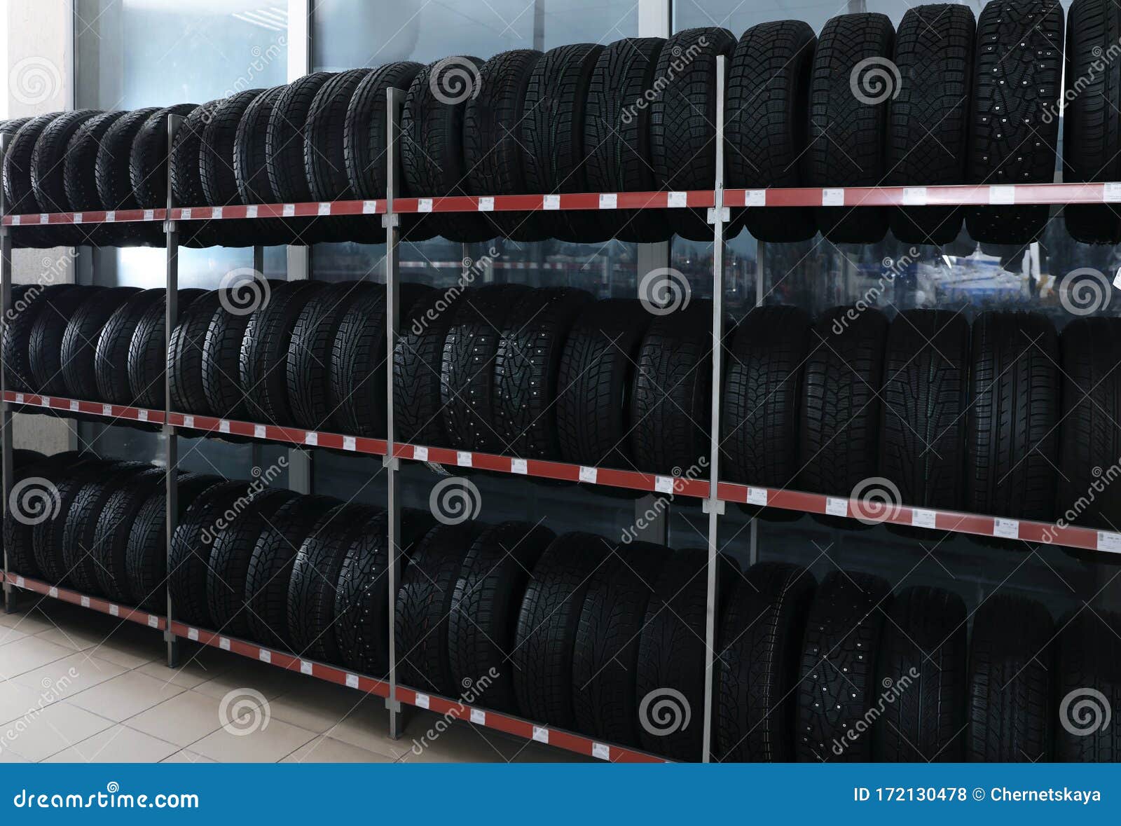 Car tires on rack in store stock photo. Image of shelves - 172130478