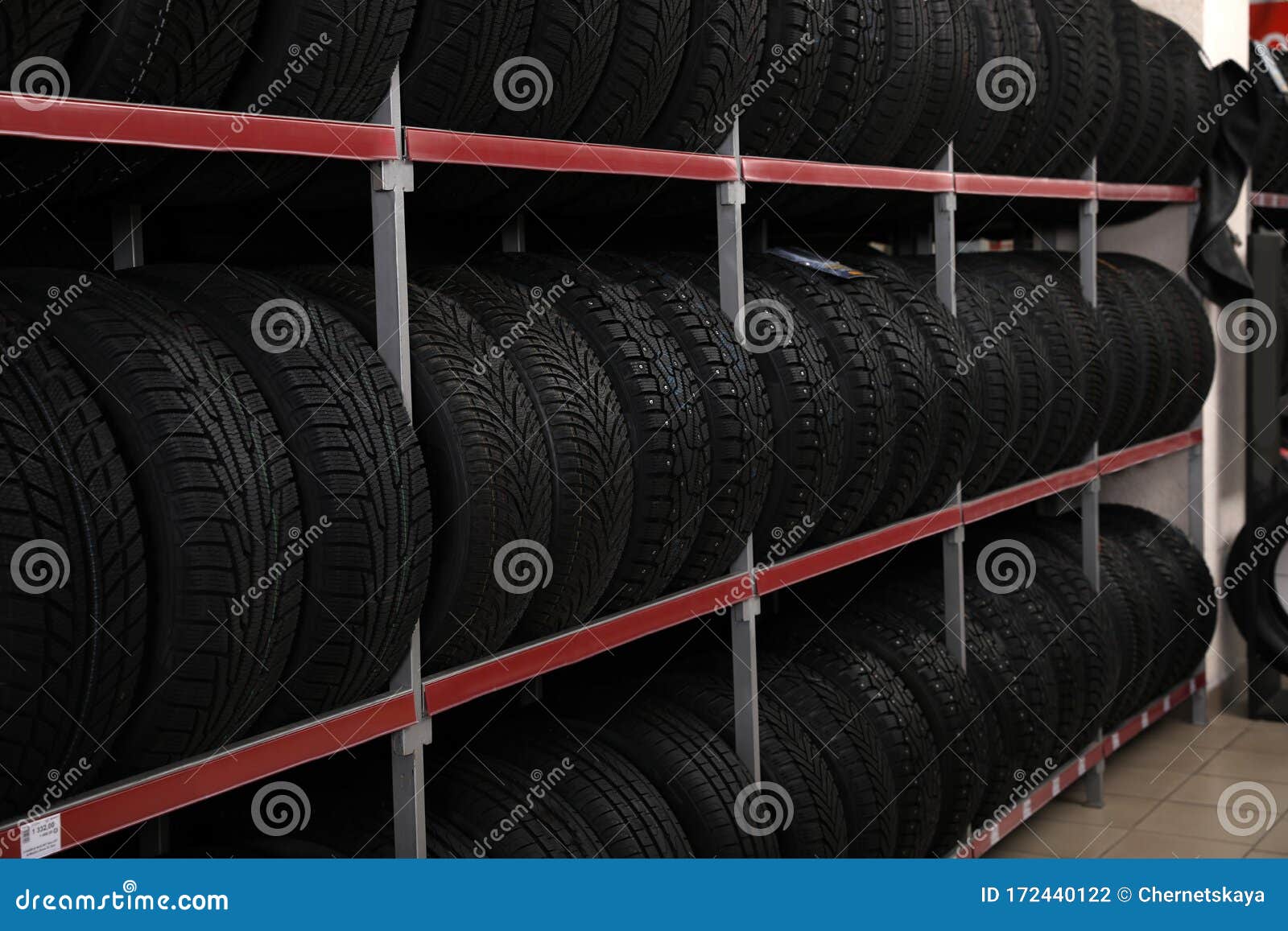 Car tires on rack in store stock photo. Image of arrangement - 172440122