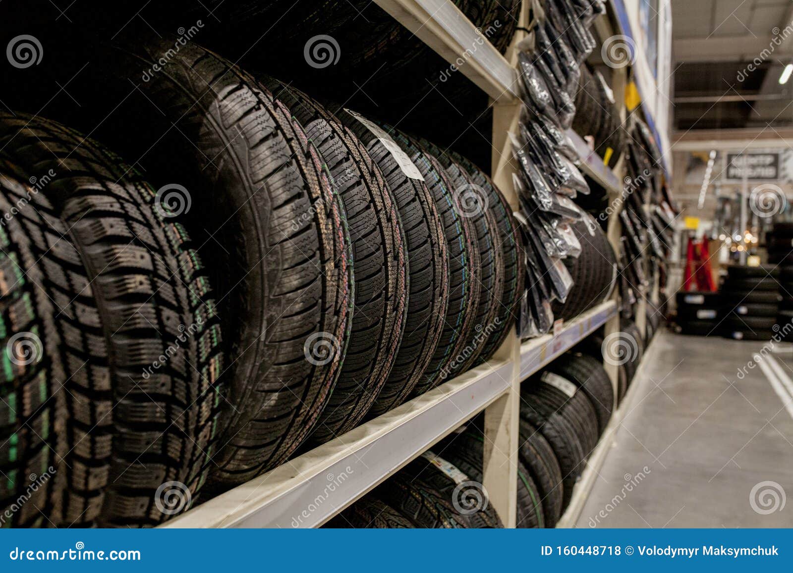 Car Tires and Wheels at Warehouse in Tire Store Stock Photo - Image of ...