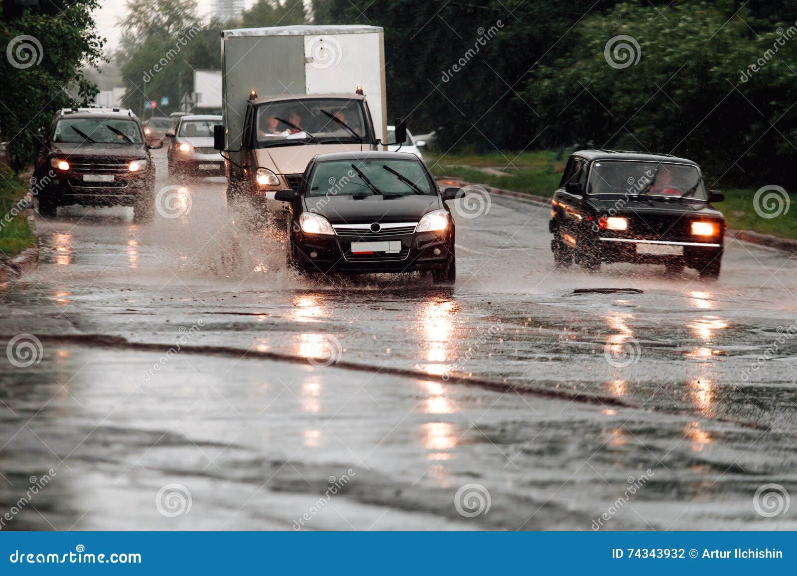 Car Traffic on Road when Heavy Rain Drops in Concrete Stock Photo ...