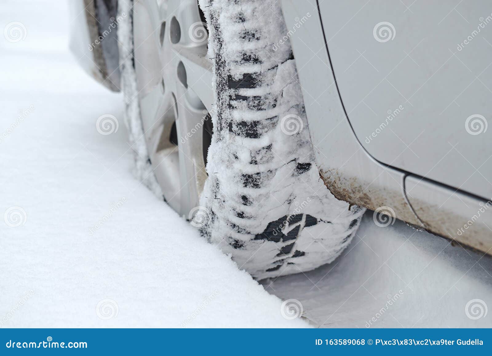 Car tyre in snow stock photo. Image of layer, season - 163589068