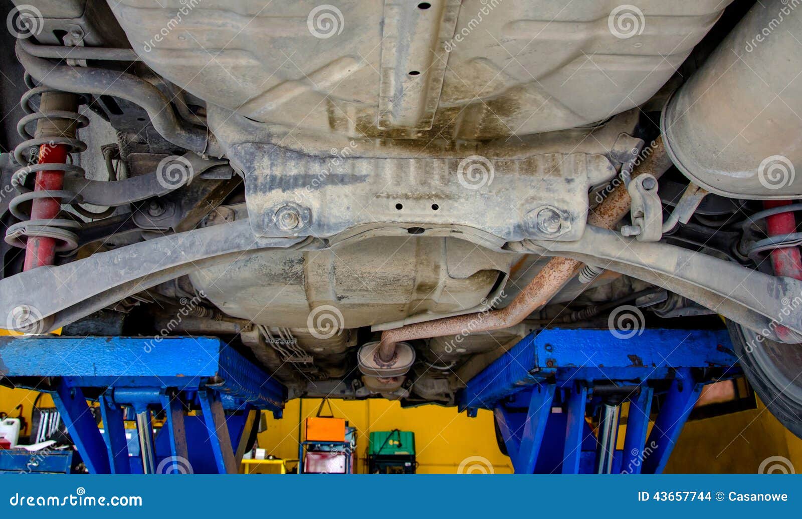 Car Under Repair on Hoist at Service Station Stock Photo - Image of ...