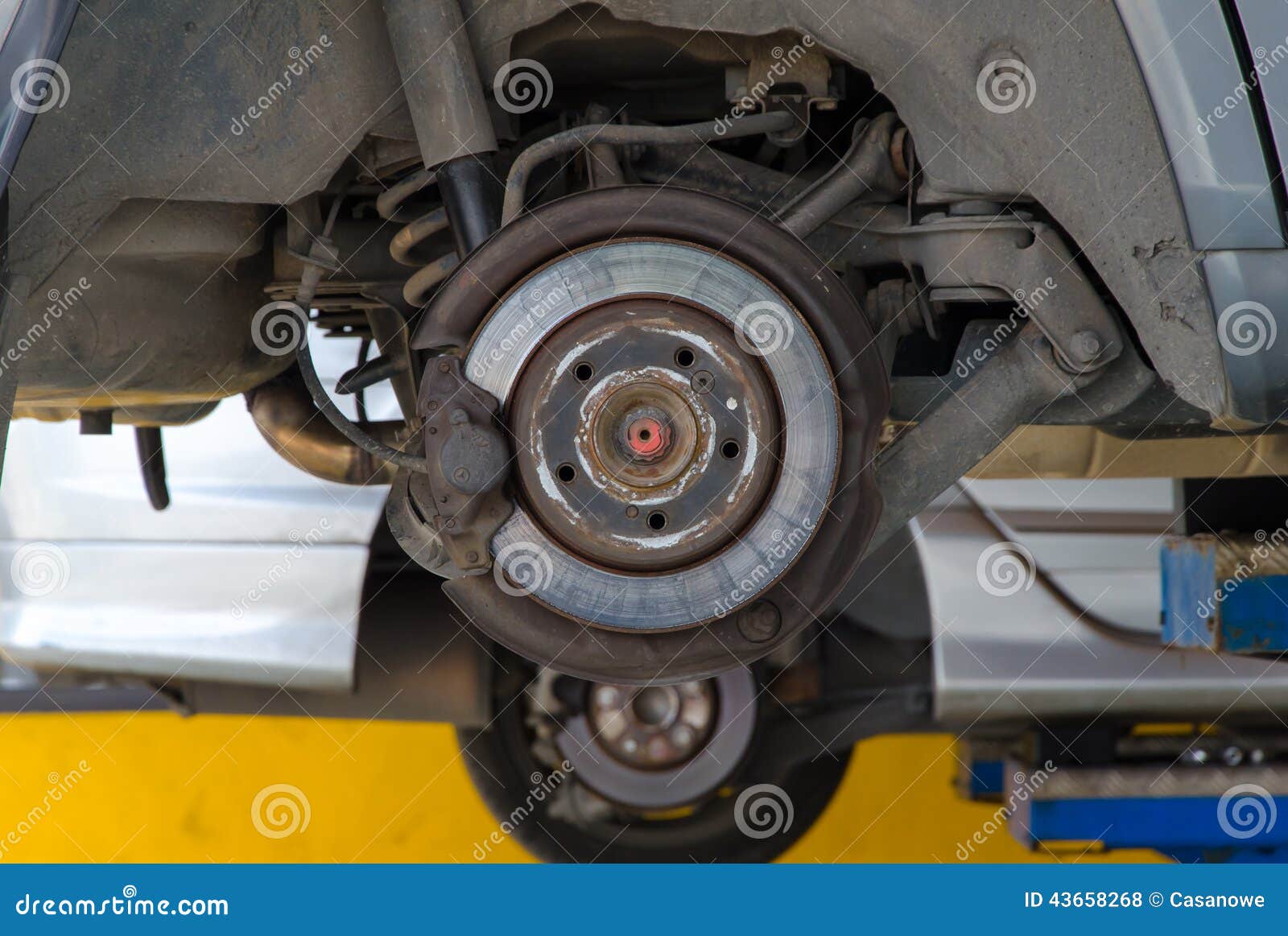 Car Under Repair on Hoist at Service Station Stock Photo - Image of ...