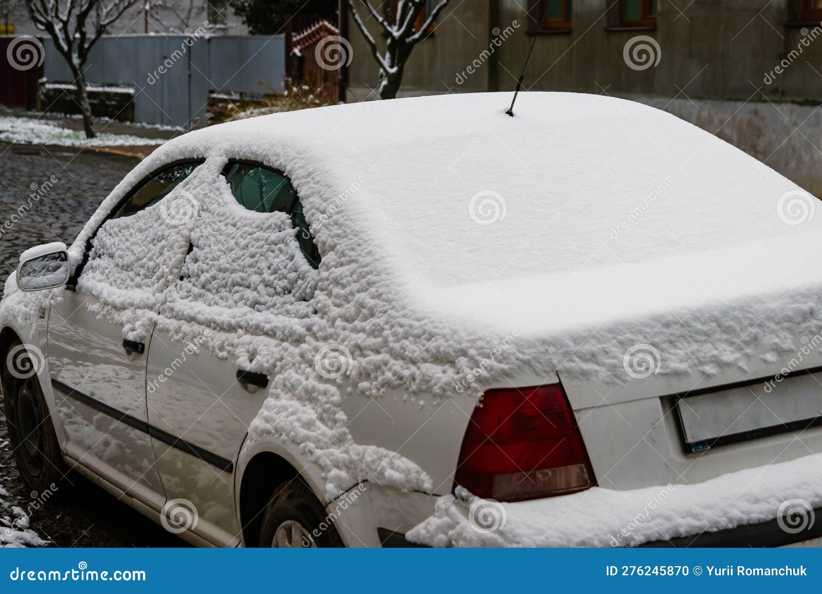 A Car Under the Snow. Parked Car in the Snow on the Pavement Stock ...