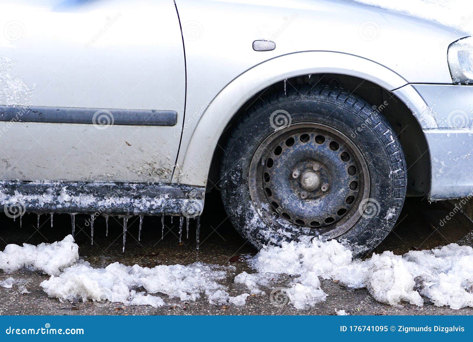 Car in Winter, Snow and Ice on the Wheel, Icicles on the Body Stock ...