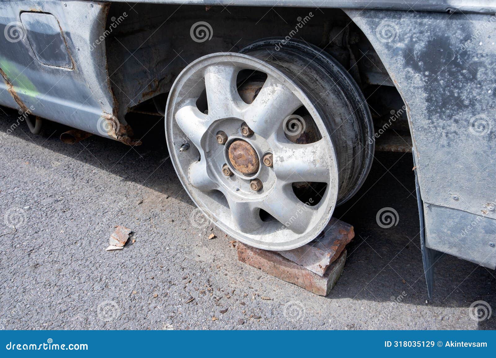 Car with a Wheel on Bricks without a Tire Stock Image - Image of ...