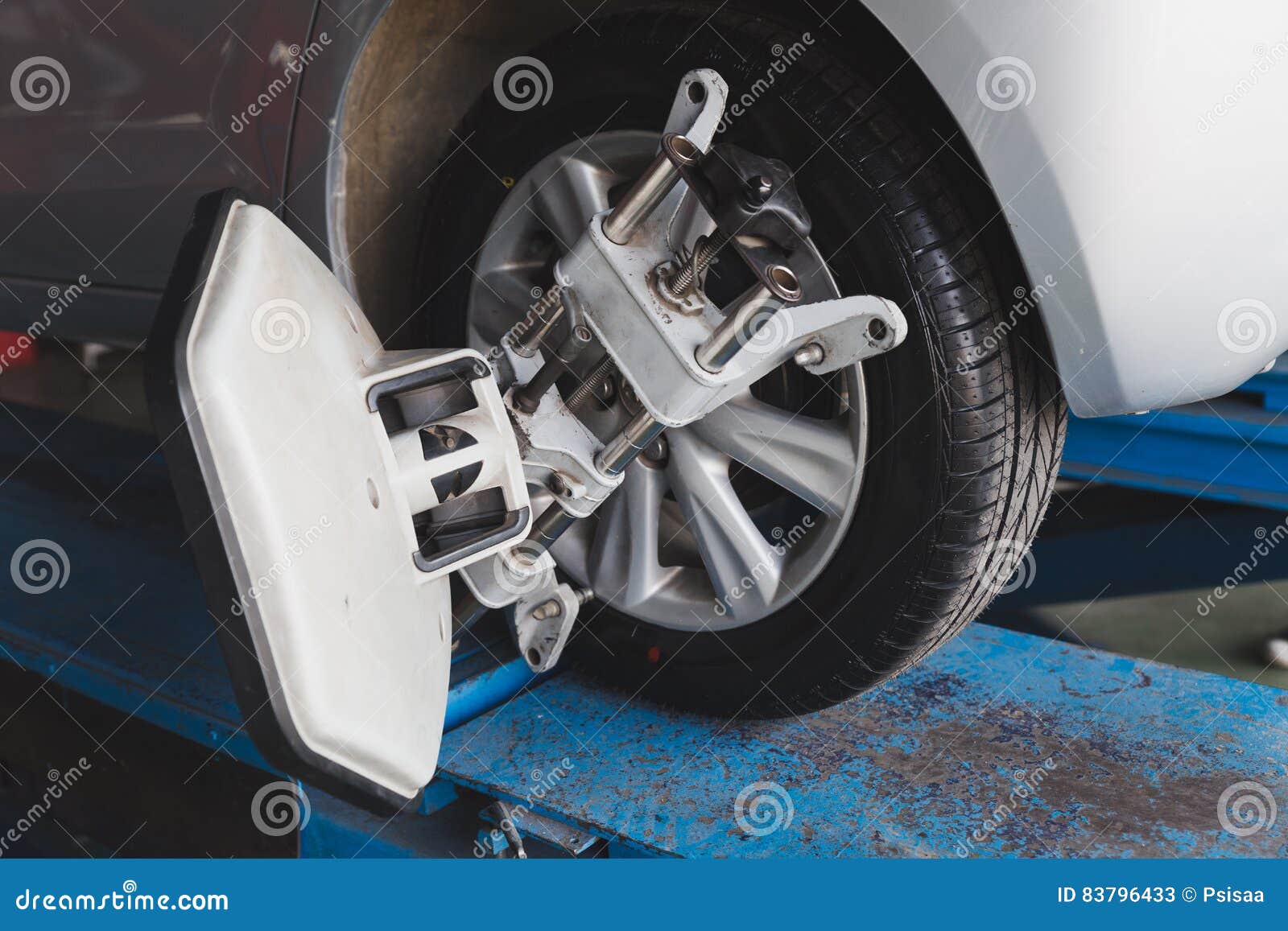 Car Wheel Fixed with Computerized Wheel Alignment Machine Clamp Stock ...
