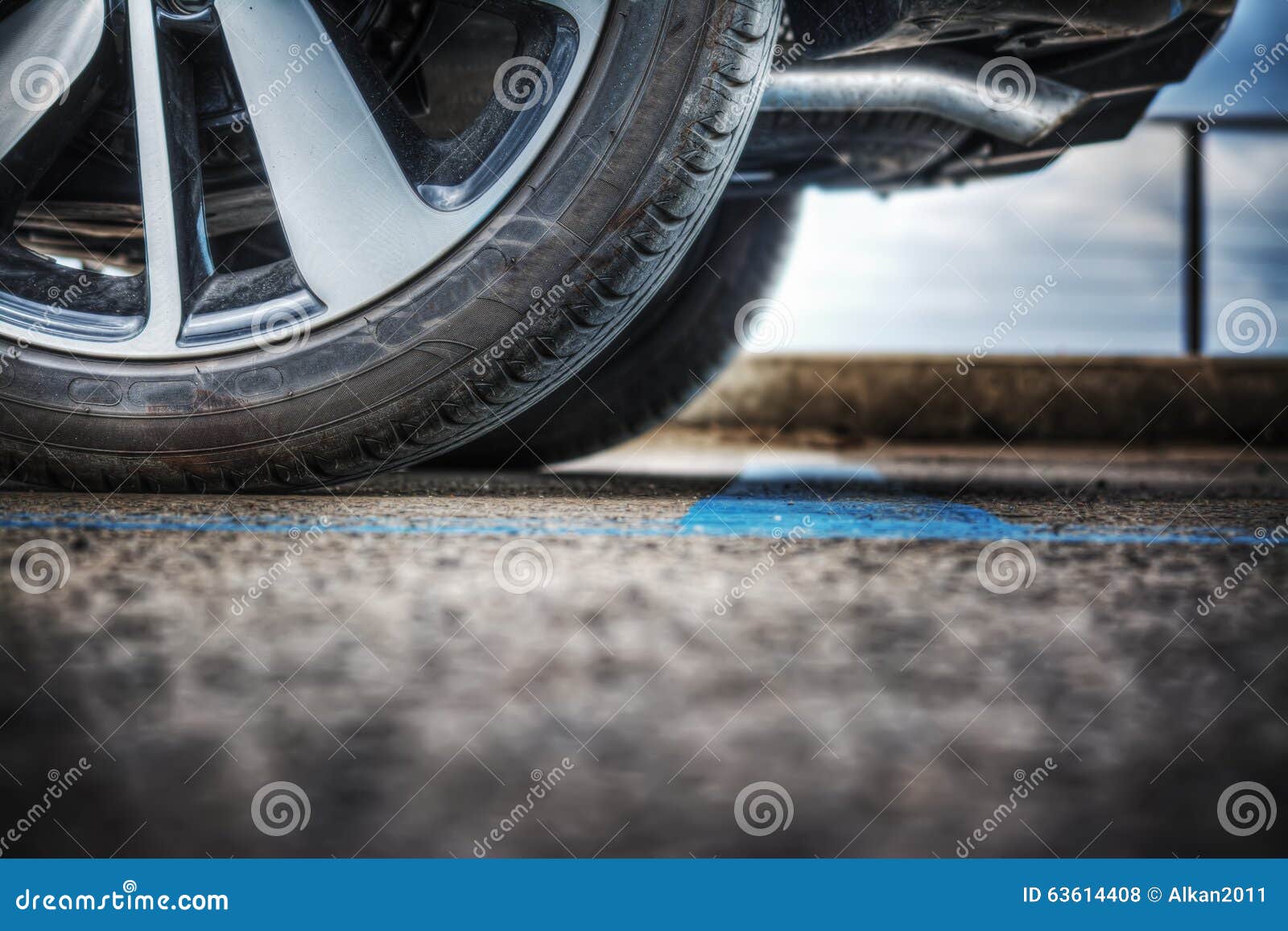 Car wheel on the ground stock photo. Image of street - 63614408