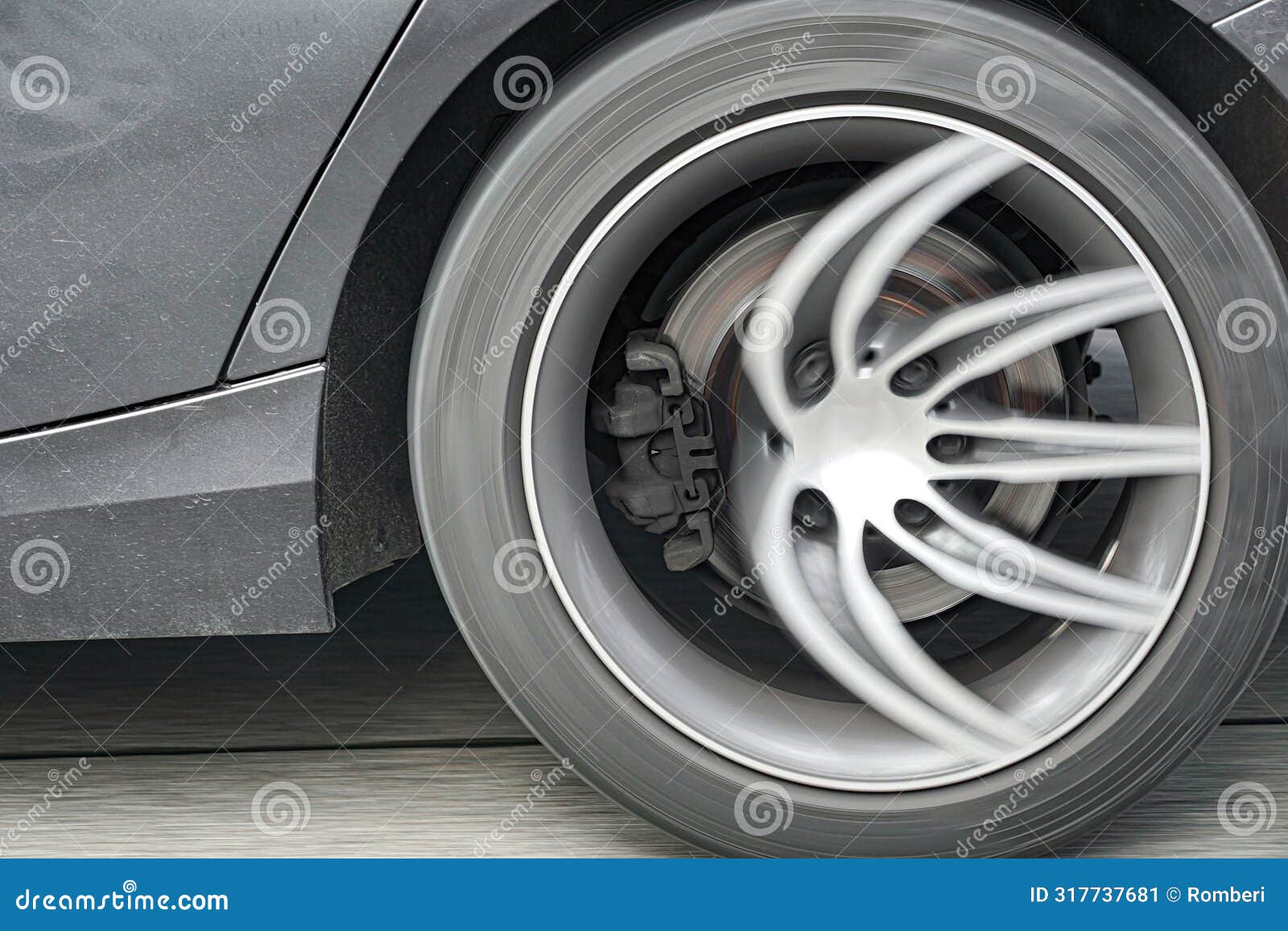 Car Wheel in Motion on the Road, Brake Caliper Stock Image - Image of ...
