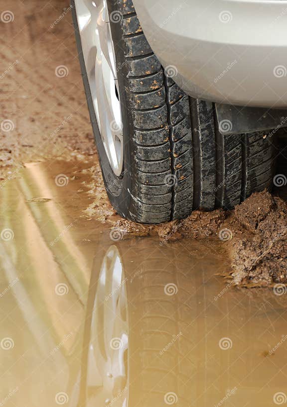 Car Wheel Reflection in Puddle after Rain Stock Photo - Image of rustic ...