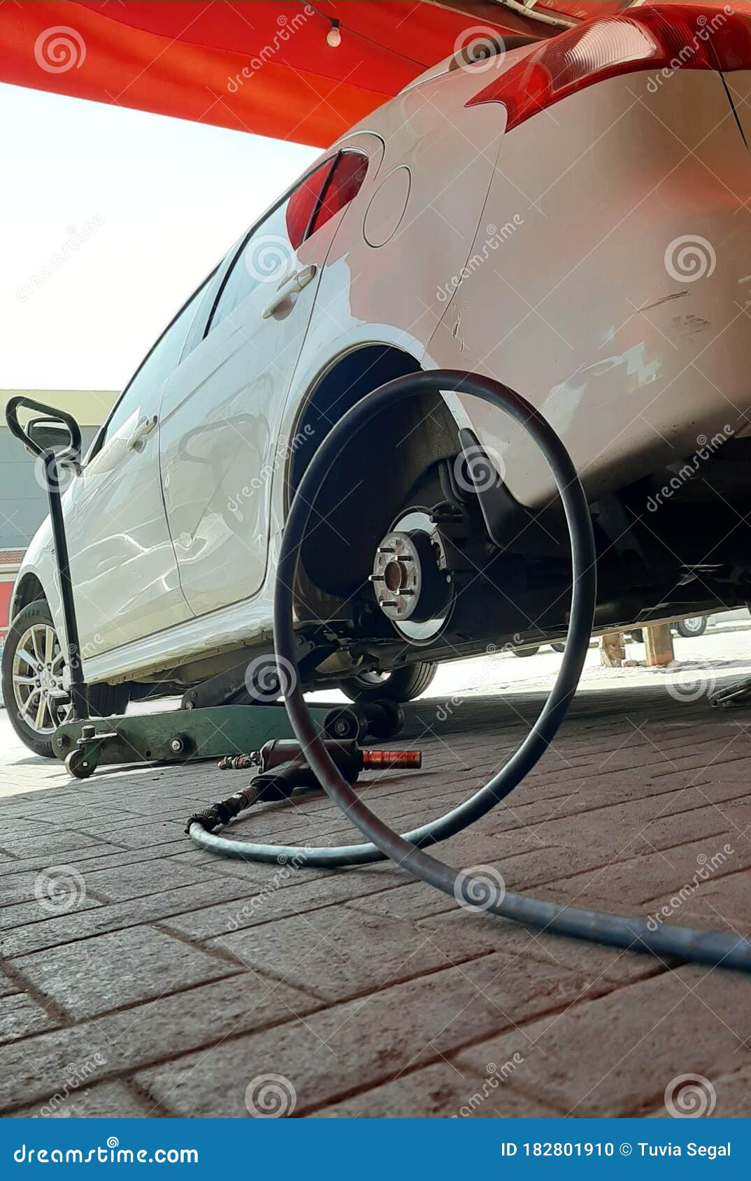 A Car Wheel Repair at the Garage Stock Photo - Image of repair, lift ...