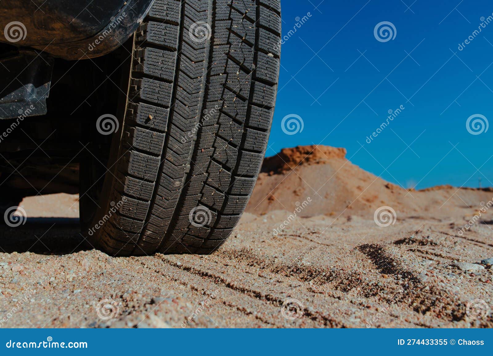 Car wheel on sand close-up stock image. Image of travel - 274433355