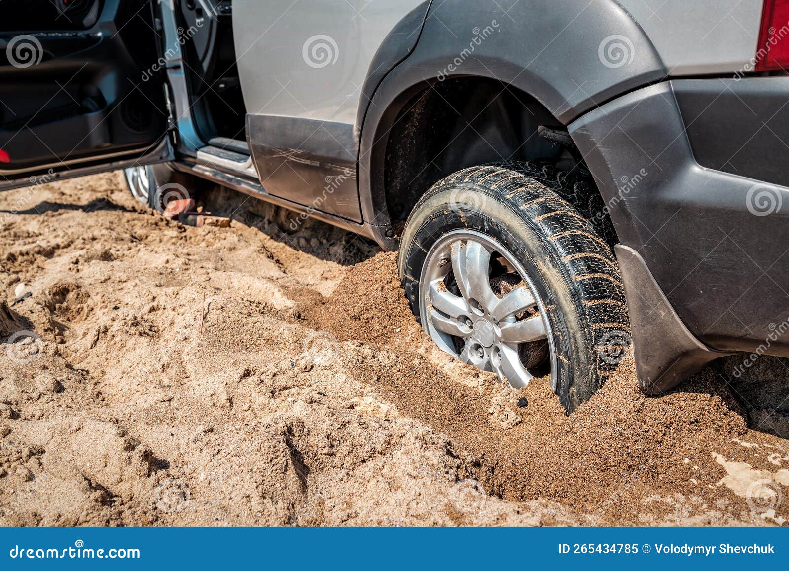Car Wheel Stuck in the Beach Sand Stock Image - Image of sand, diging ...