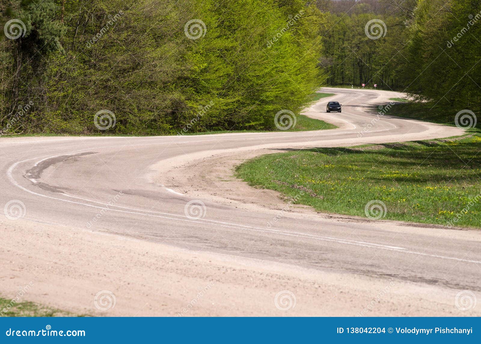 A Car on a Winding Road in a Forest. Stock Photo - Image of traffic ...