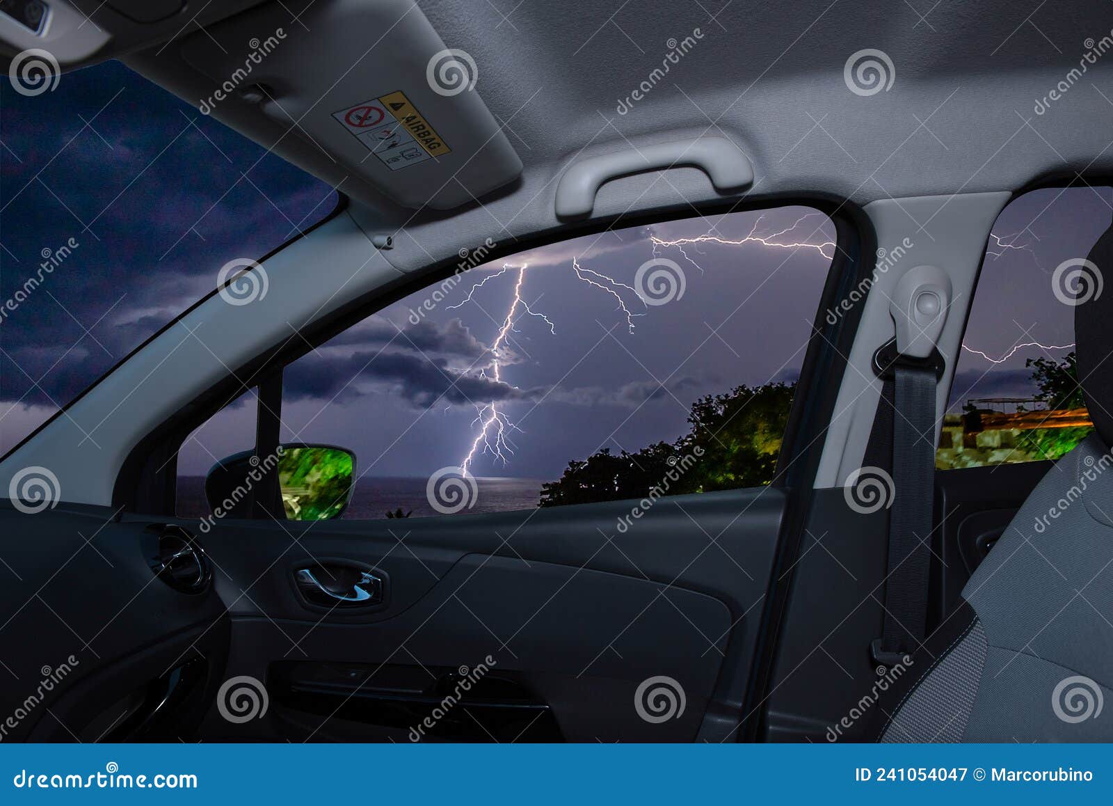 Car Window with View of Lightning Storm Over the Sea Stock Image ...