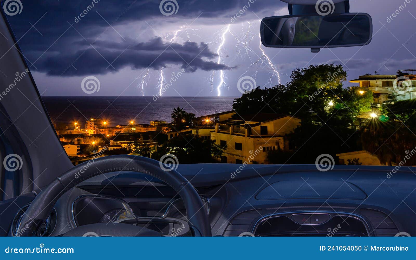 Car Windshield with View of Lightning Storm Over the Sea Stock Photo ...