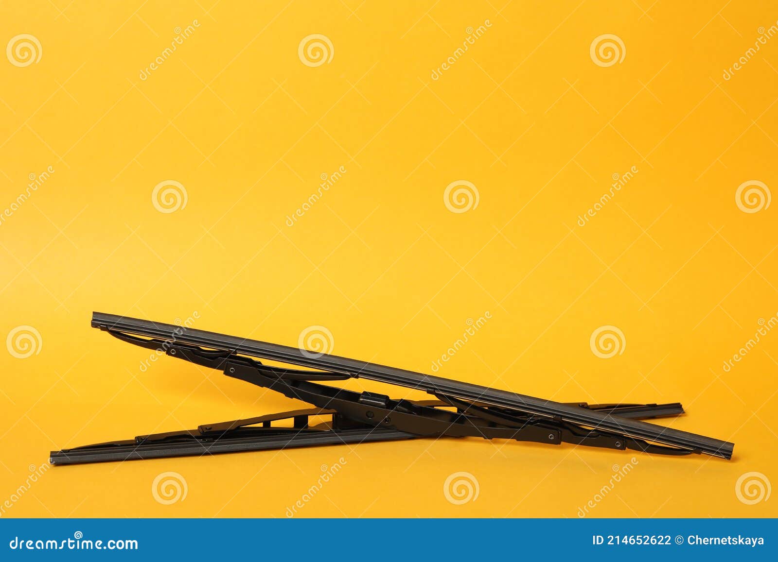 Car Windshield Wipers on Yellow Background. Space for Text Stock Photo ...