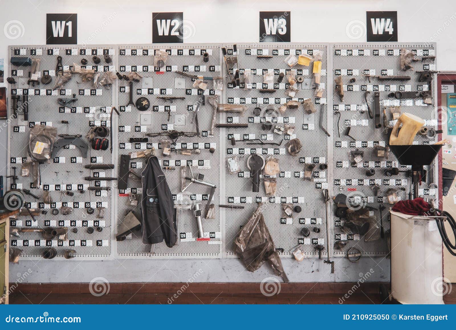 In Car Workshop There are Many Spare Parts Hanging on the Wall Stock ...