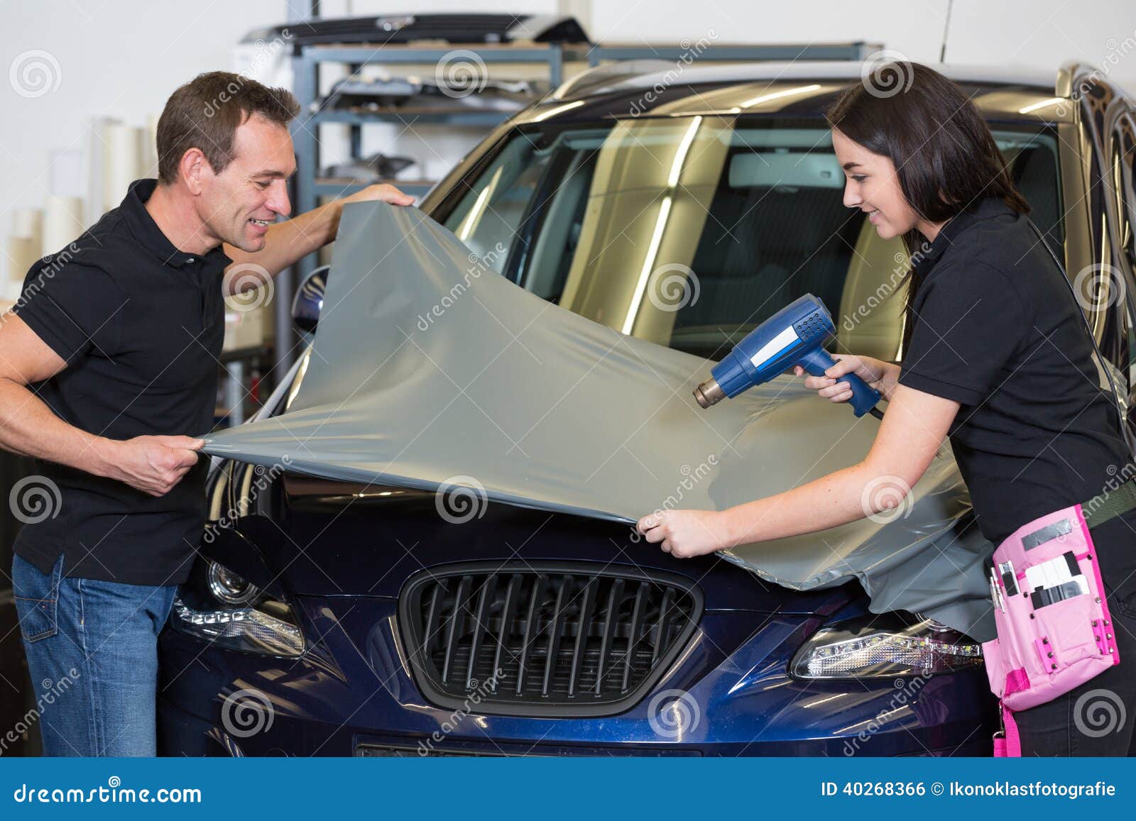 Car Wrappers Attach Grey Vinyl Foil To Vehicle Stock Photo - Image of ...