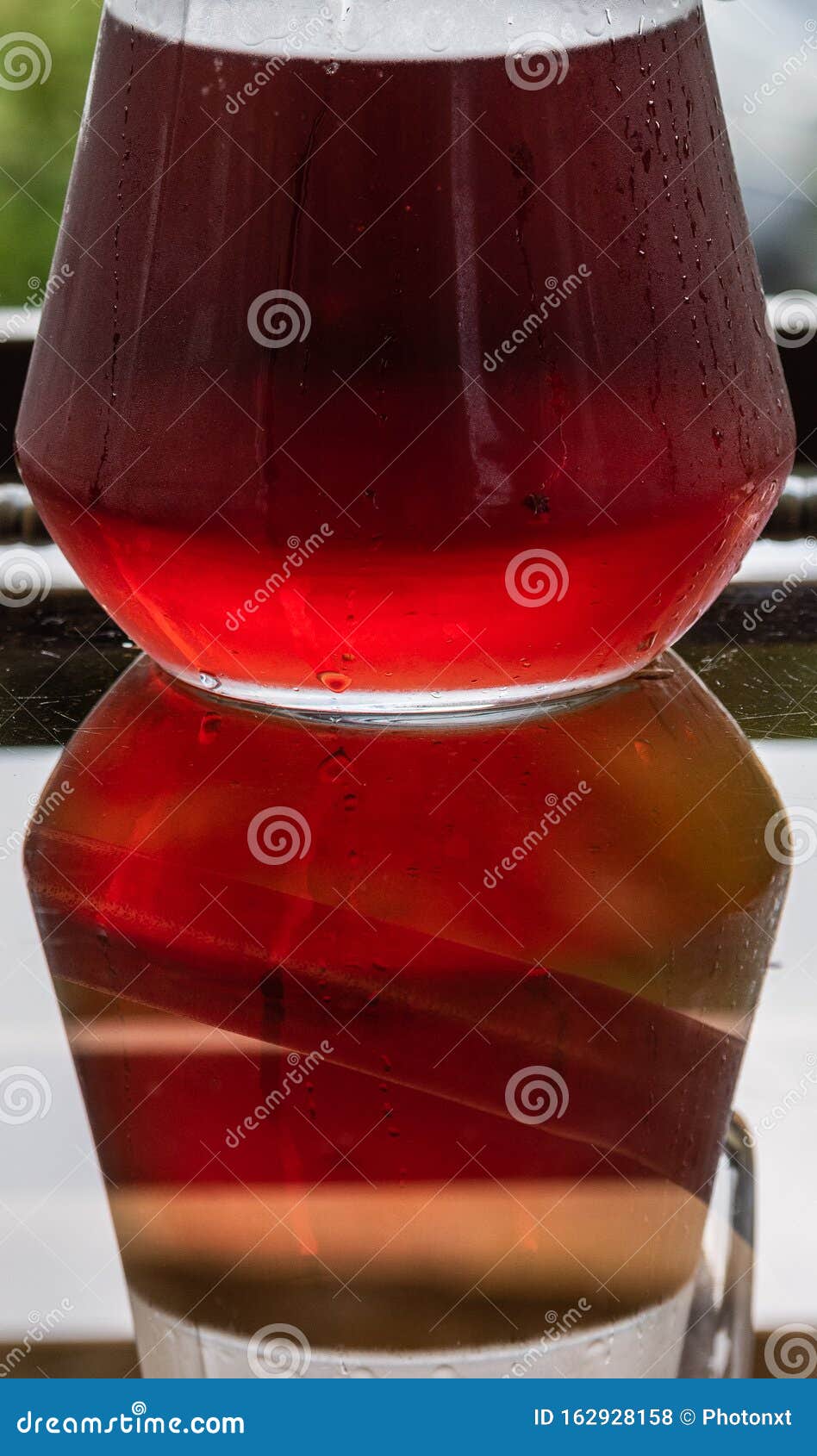Carafe of Red Wine on a Reflective Surface - Outdoor Table Stock Photo ...
