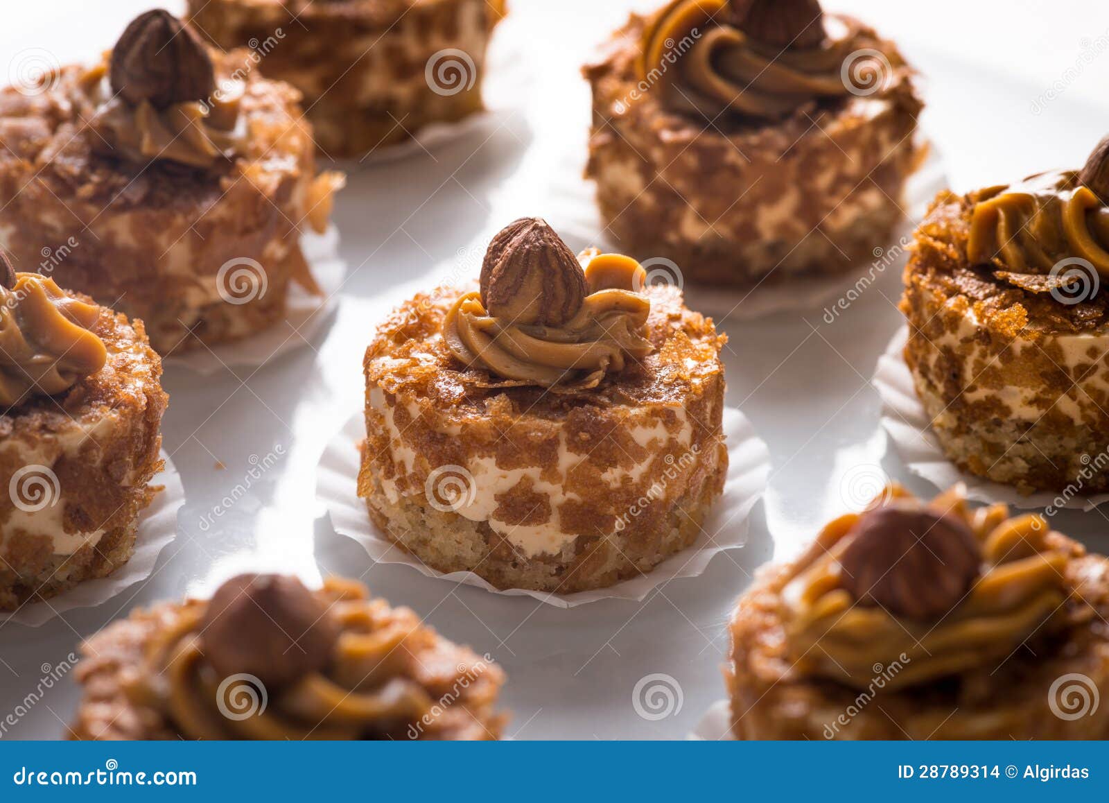 Caramel cakes with nuts stock photo. Image of paper, baked - 28789314