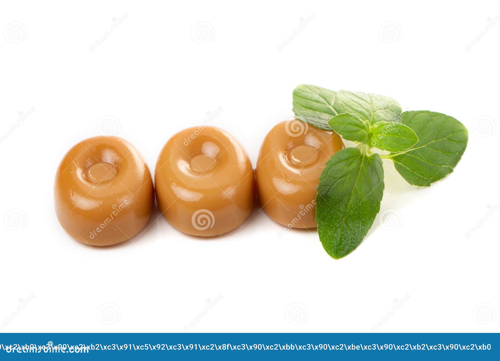 Caramel Candies Decorated with Mint Leaf on a White Background Close-up ...