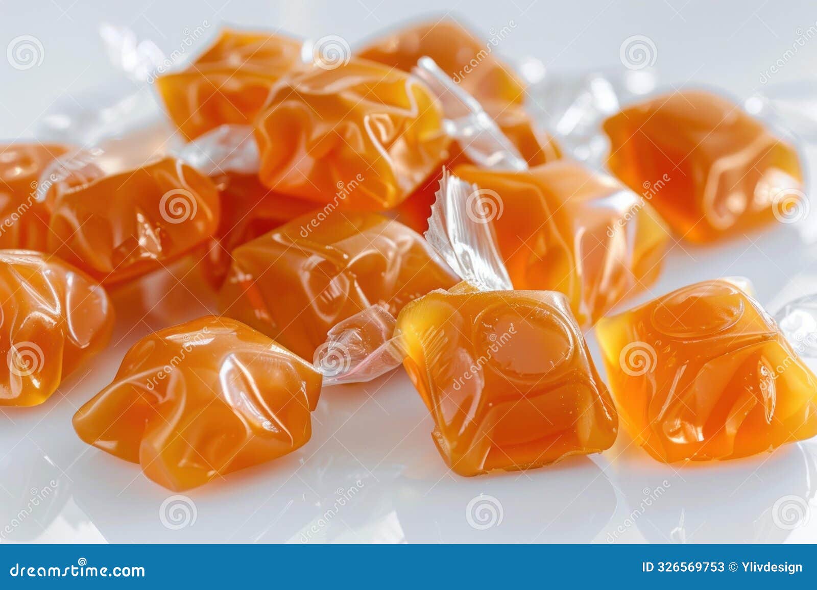 Sweet Caramel Candies Wrapped in Clear Plastic Lying on White Surface ...