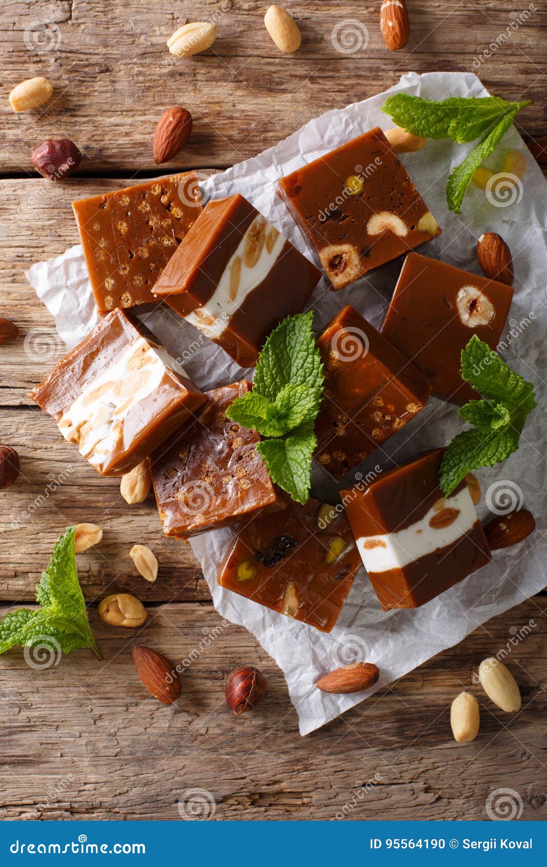 Caramel Candy with Nuts Close-up on the Table. Vertical Top View Stock ...