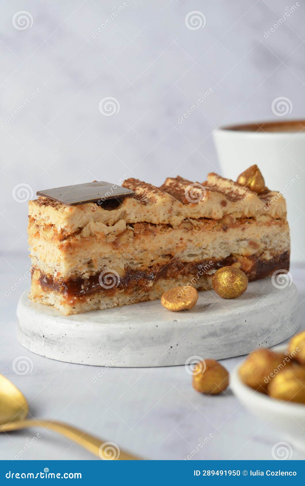 Caramel and Hazelnut Cake, Dacquoise Cake on Bright Background Stock ...