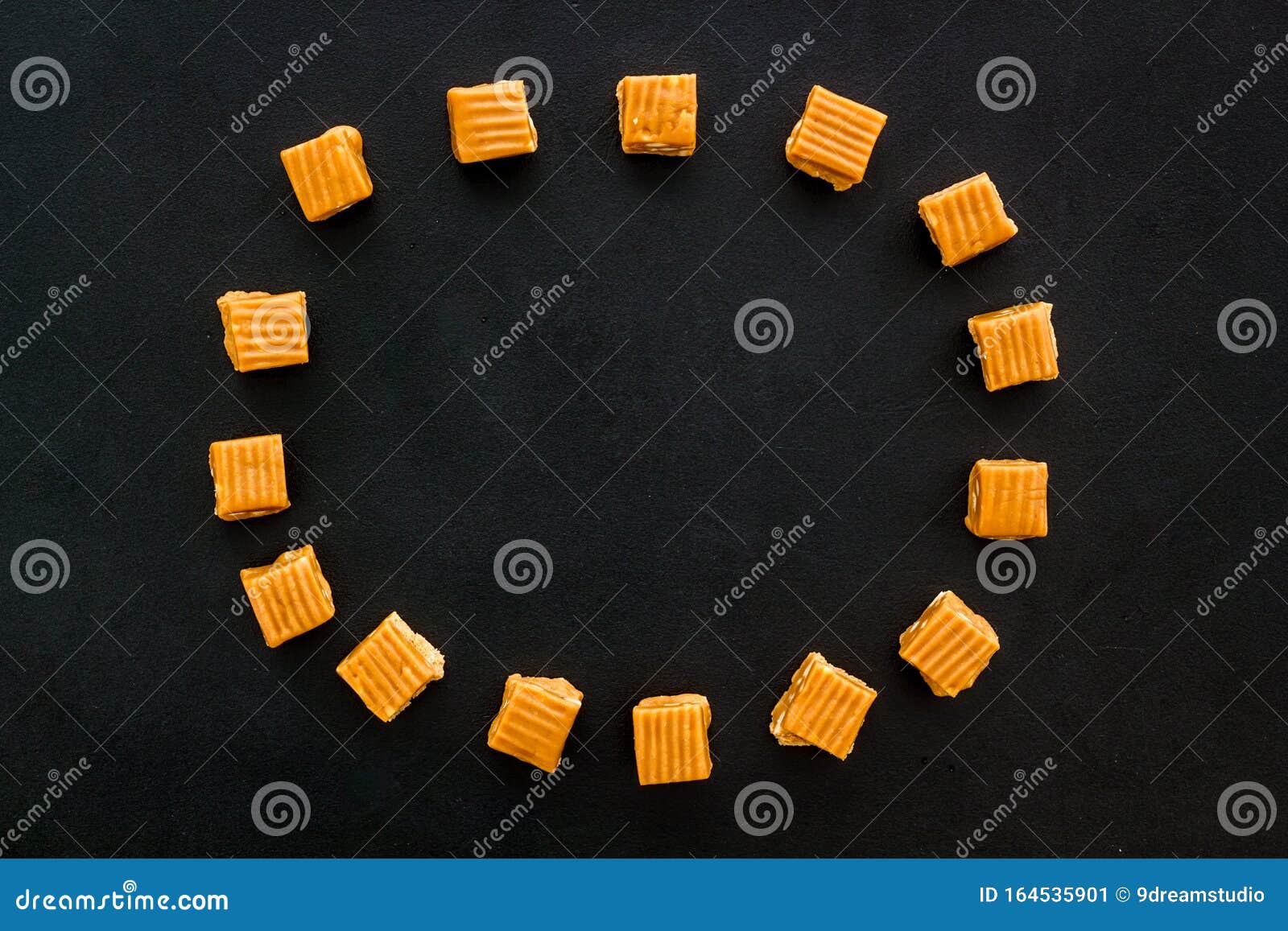 Caramel Pieces - Round Lined with Sweets - on Black Background Top View ...