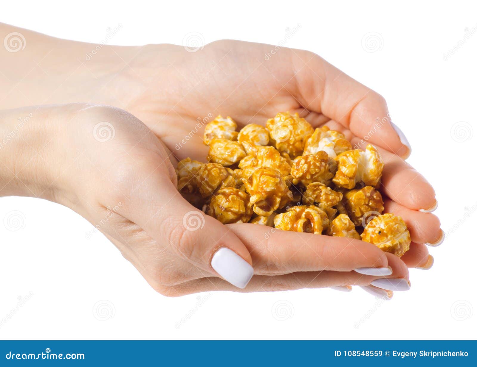 Caramel popcorn in hand stock image. Image of delicious - 108548559