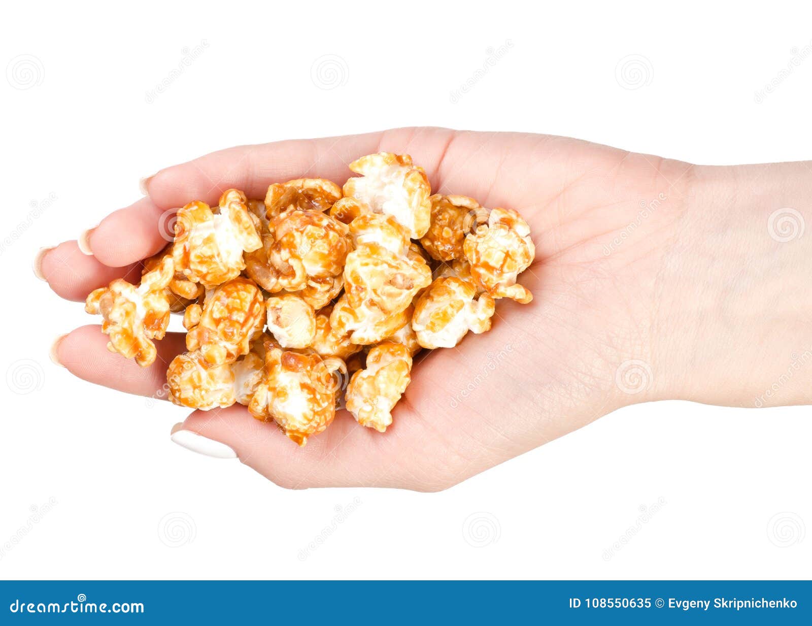 Caramel popcorn in hand stock image. Image of dessert - 108550635