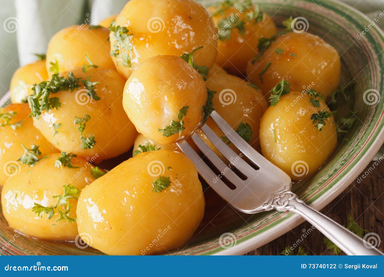 Caramelized New Potatoes with Herbs Close-up on a Plate. Horizon Stock ...