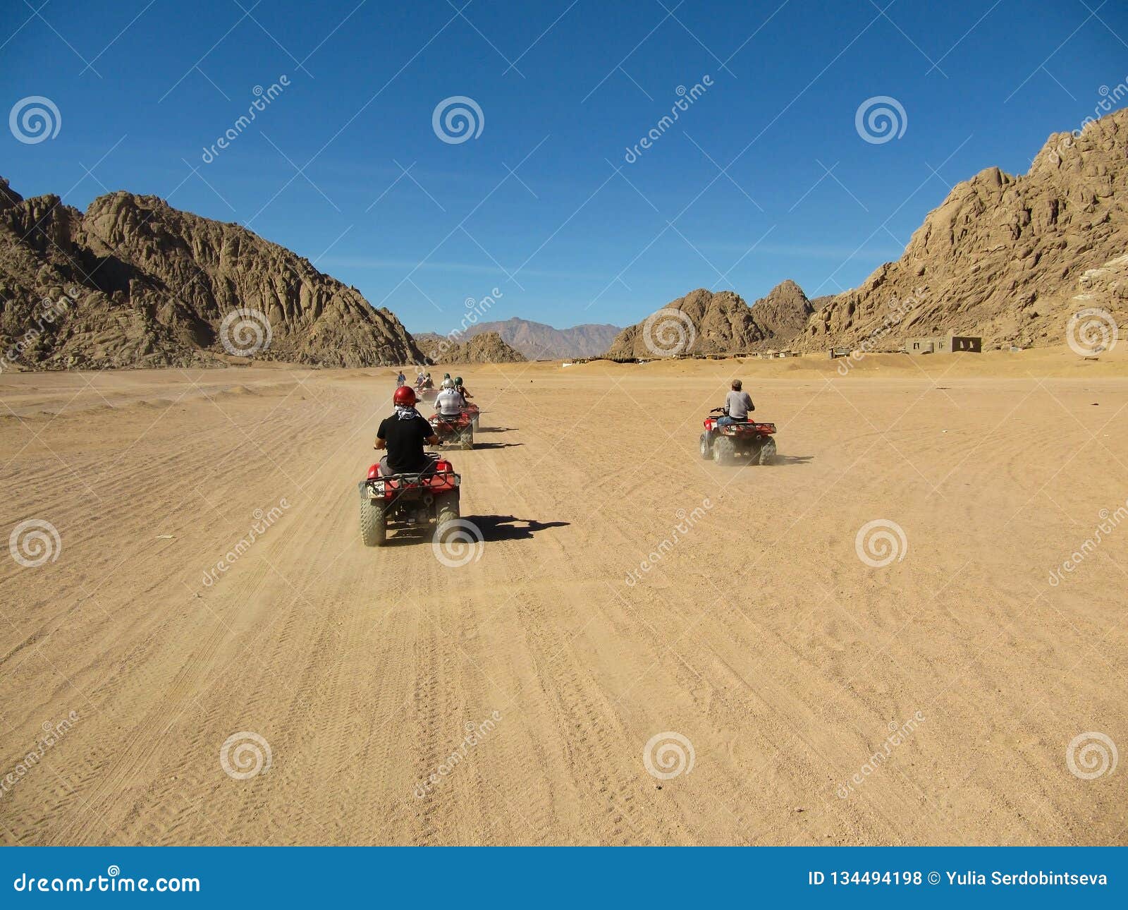 Caravan ATV Racing at High Speed through the Desert Editorial Stock ...