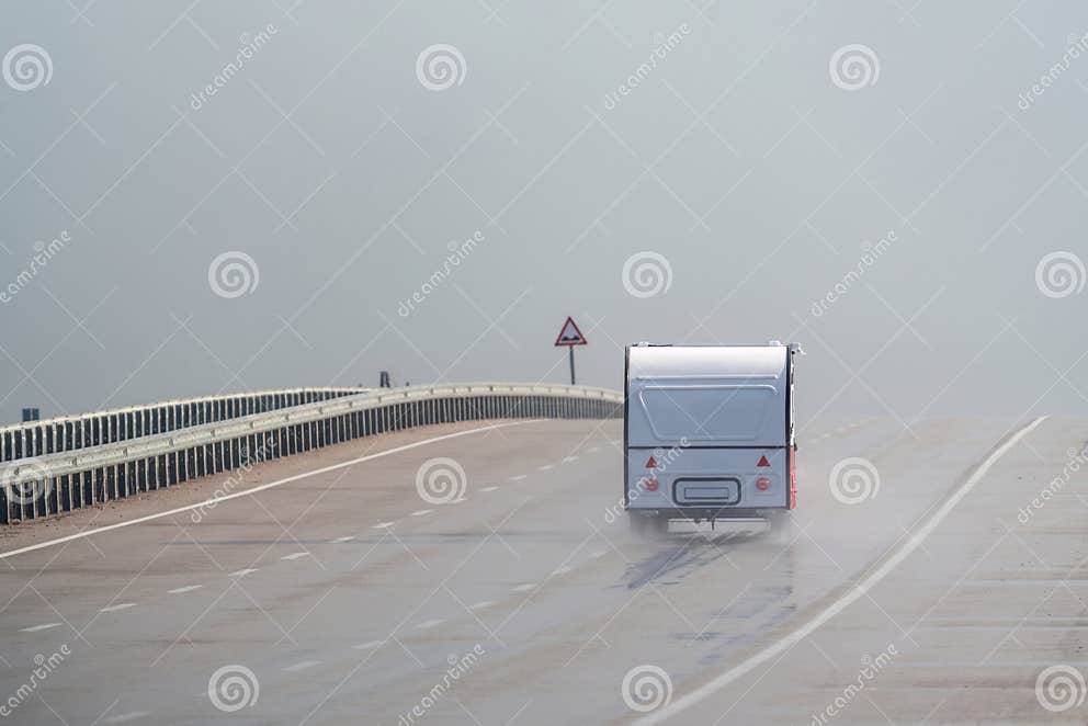 Caravan Driving on the Motorway in the Rain. Motorway in the Rain Stock ...