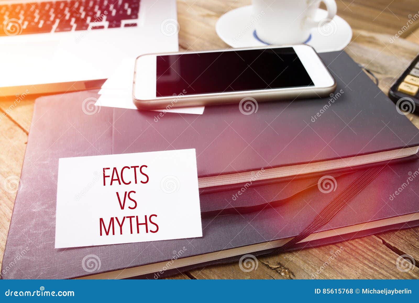 Card Saying Myths and Facts on Note Pad Stock Photo - Image of phone ...