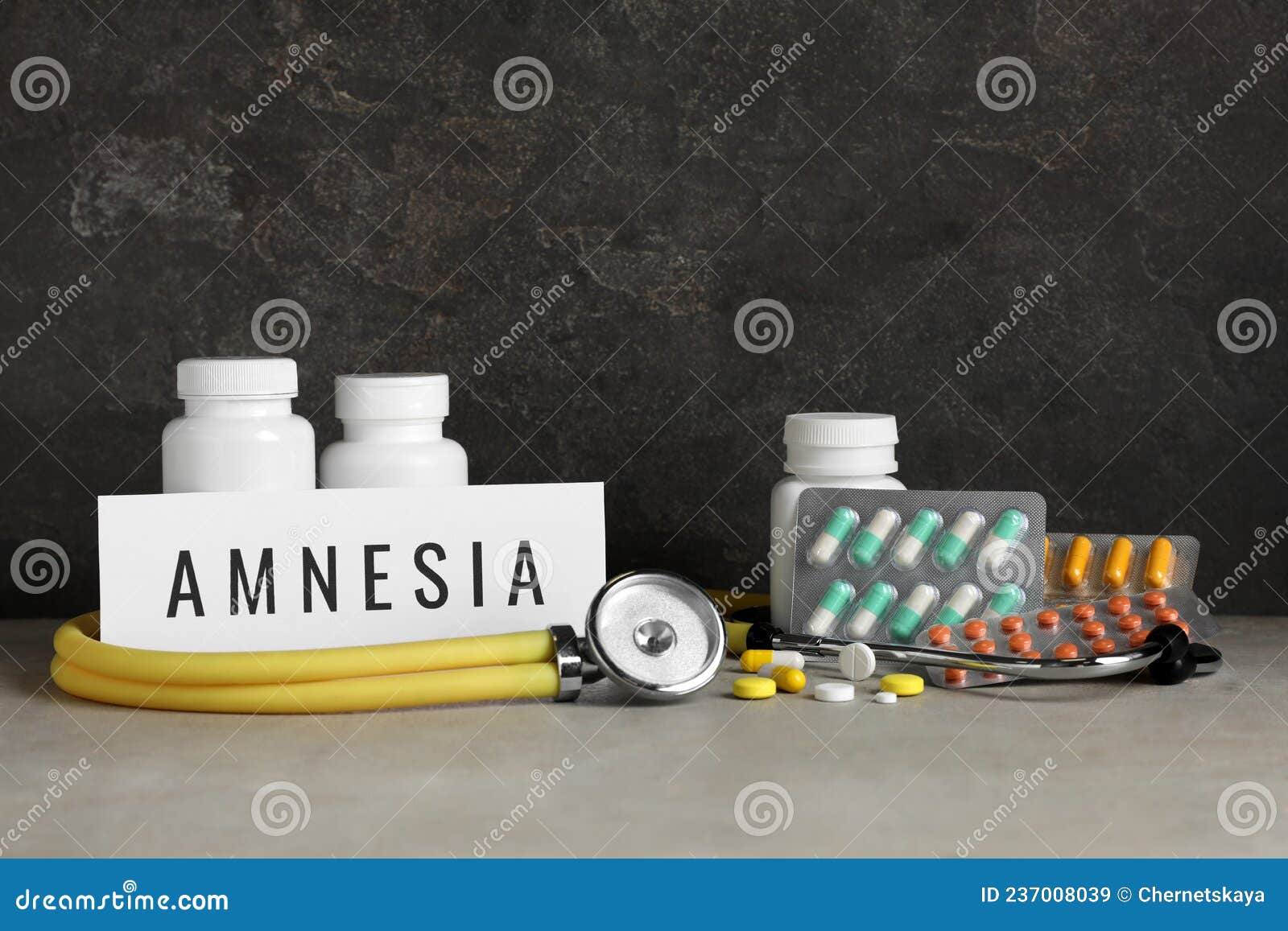 Card with Word Amnesia, Drugs and Stethoscope on Light Grey Table Stock ...