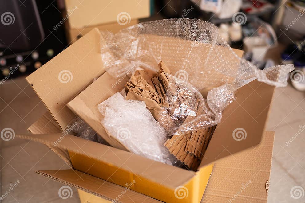 Cardboard Box with Bubble Wrap and Kraft Paper for Packaging Stock ...