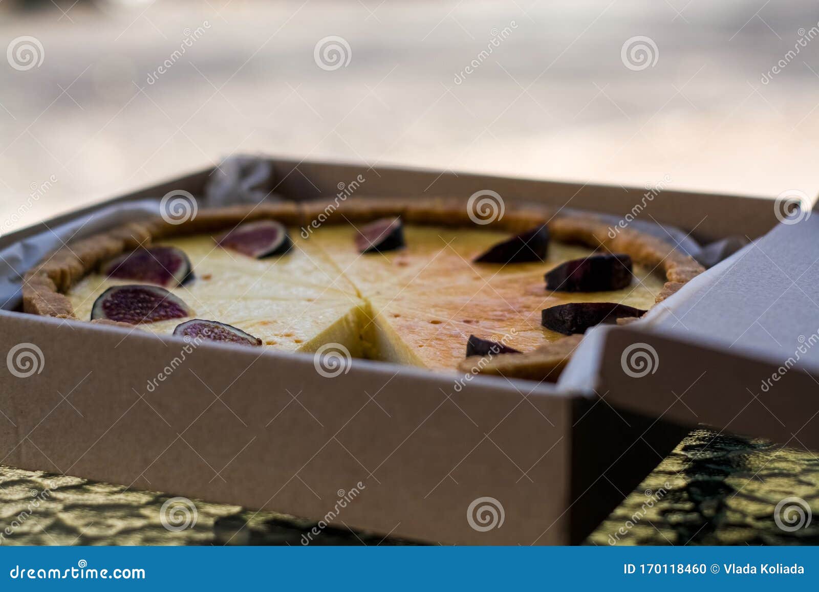 Cardboard Box with Cut Pie. Clasic Cheesecake with Slices of Fresh Figs ...