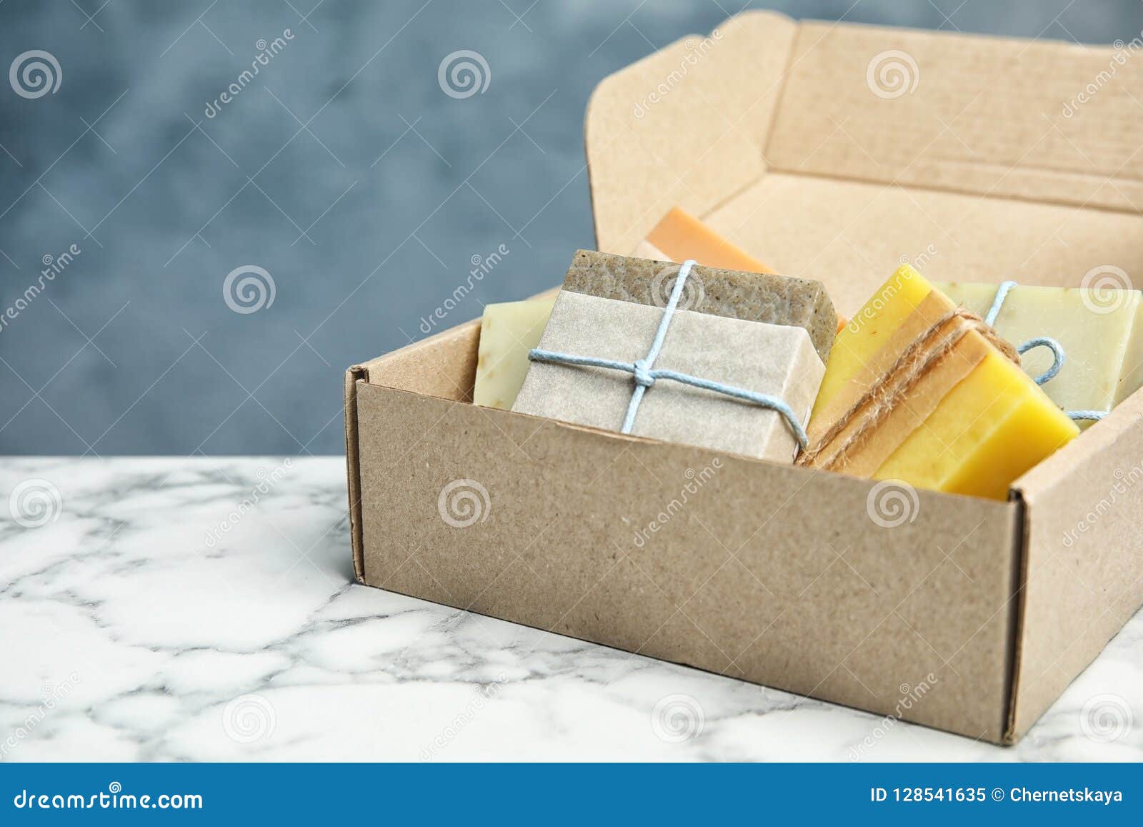 Cardboard Box with Different Handmade Soap Bars on Table Stock Image ...
