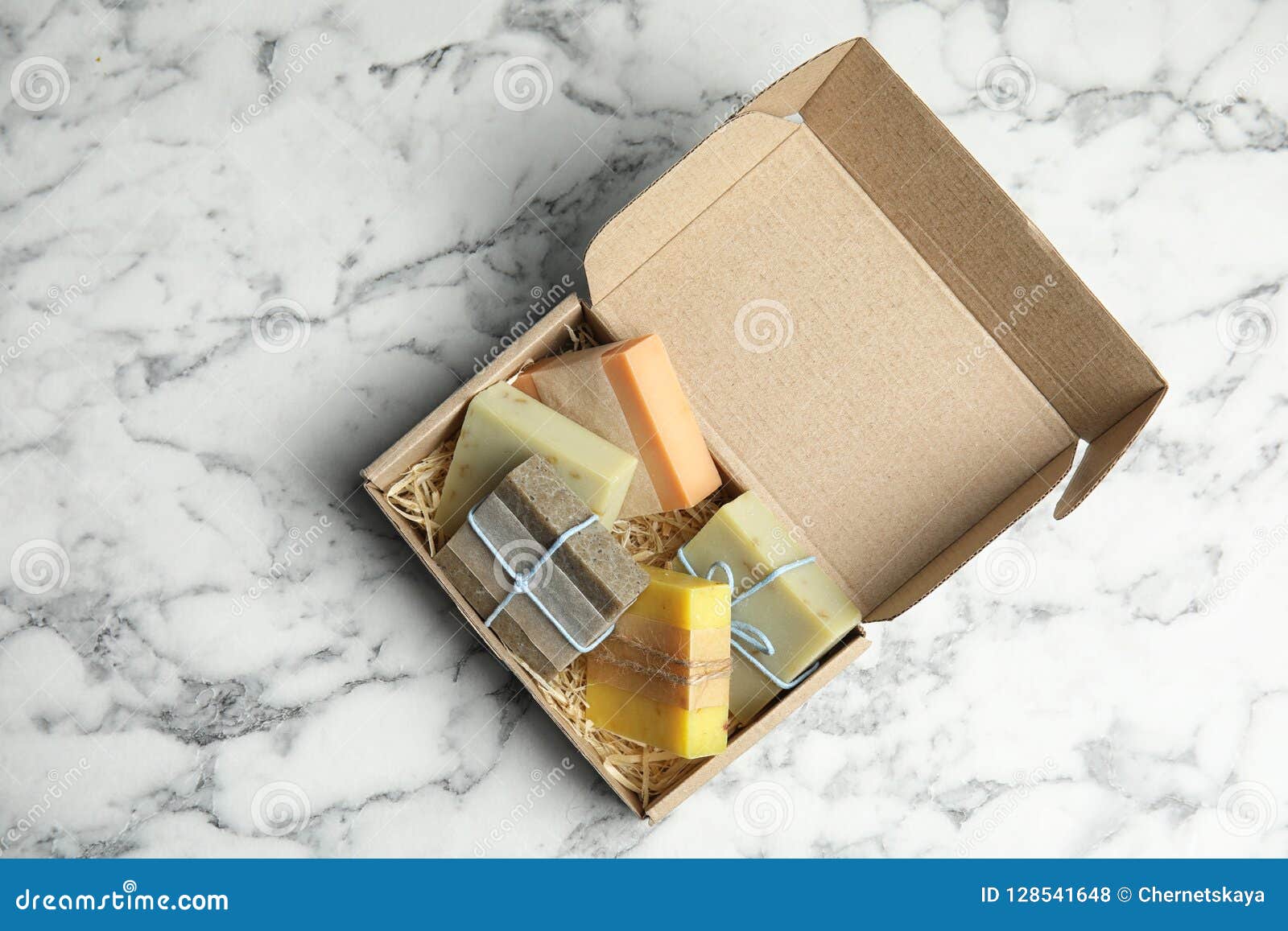 Cardboard Box with Different Handmade Soap Bars on Table Stock Photo ...