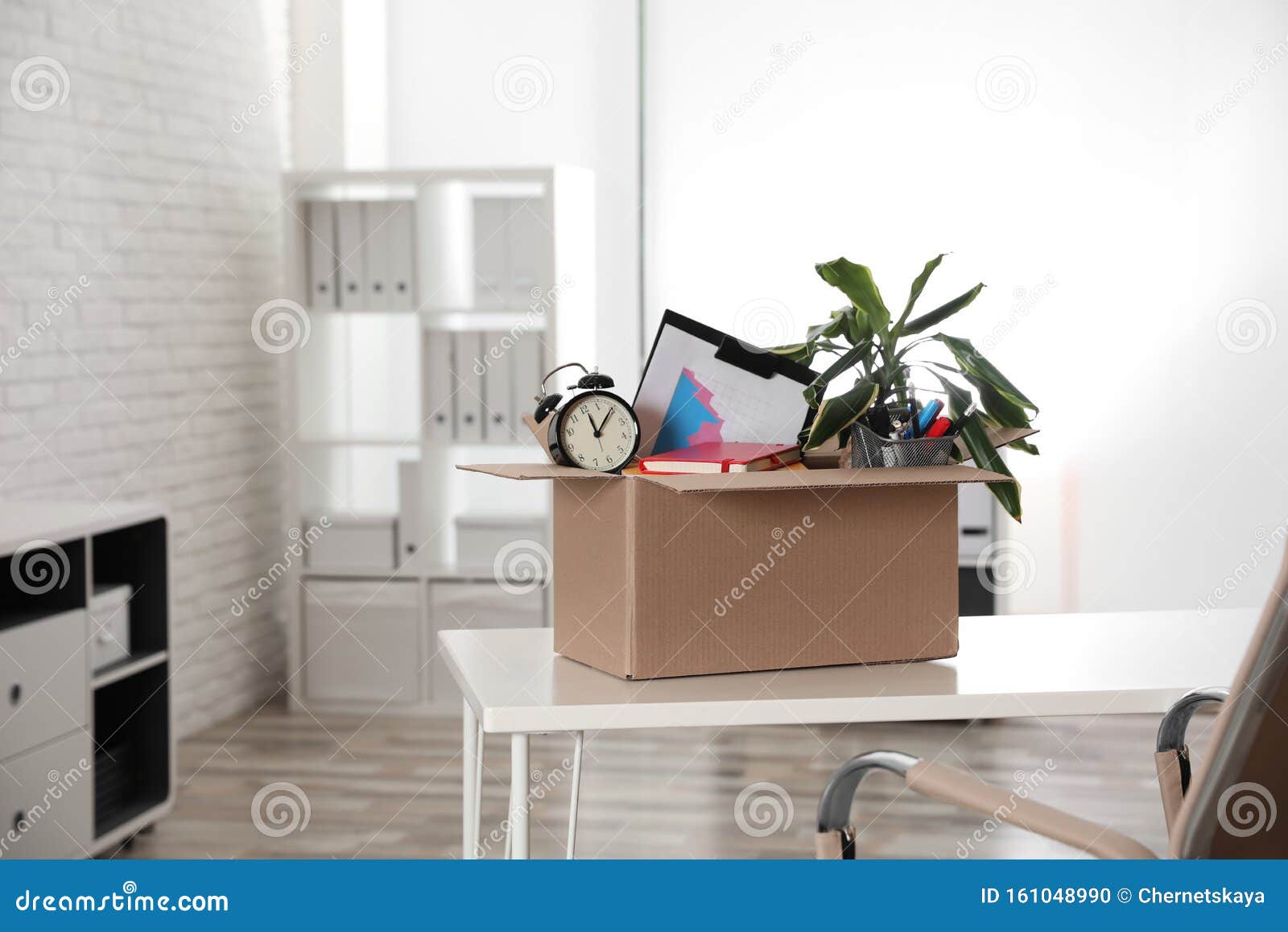 Cardboard Box Full of Stuff on Table Stock Photo - Image of layoff ...