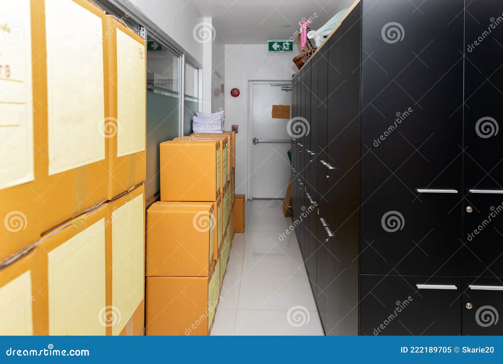 Cardboard Box with Products and File Cabinet in the Warehouse Stock ...