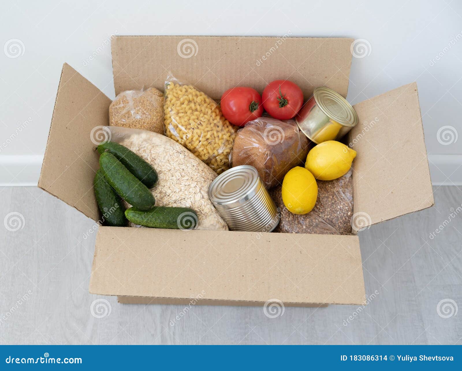 Cardboard Box with a Set of Food Items. Delivery Concept Stock Photo ...
