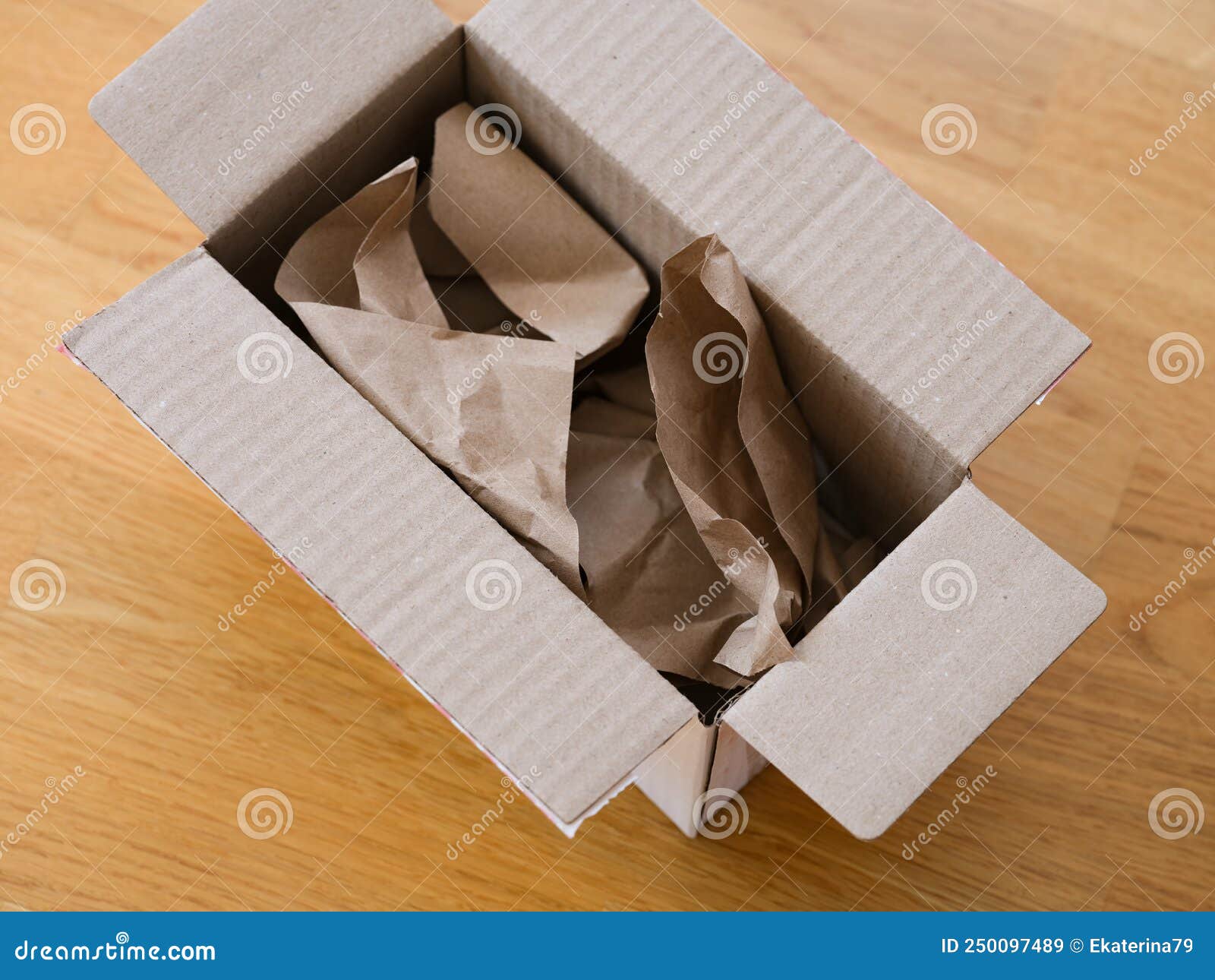 A Cardboard Box with Some Paper Inside Stock Image - Image of open ...