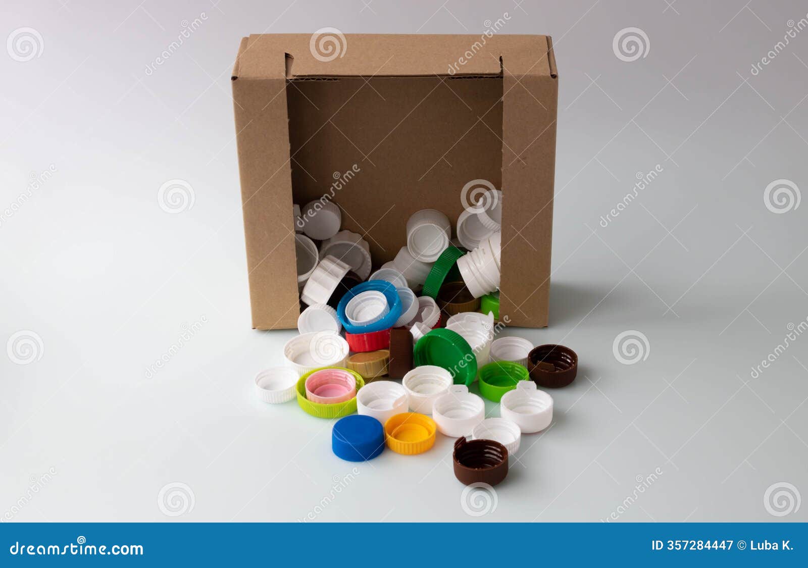 Cardboard Box with Spilled Multicolored Plastic Bottle Caps Stock Image ...